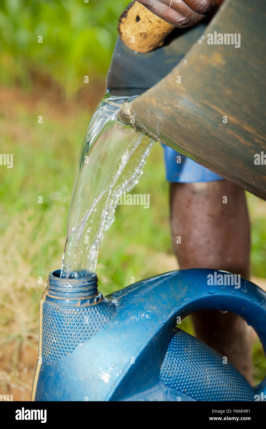 Pouring water bucket hi-res stock photography and images - Alamy