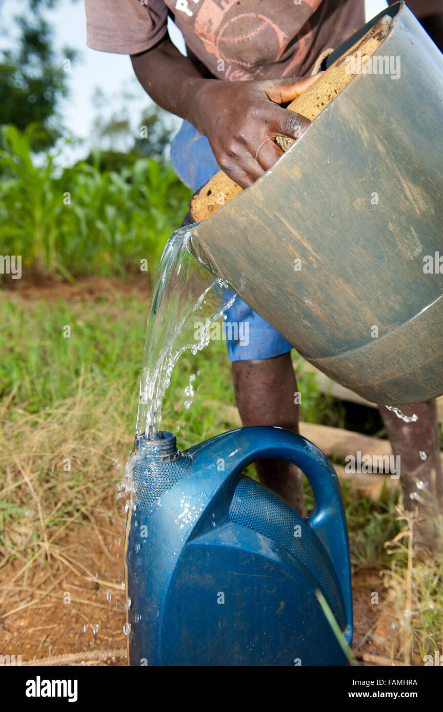 Pouring water bucket hi-res stock photography and images - Alamy