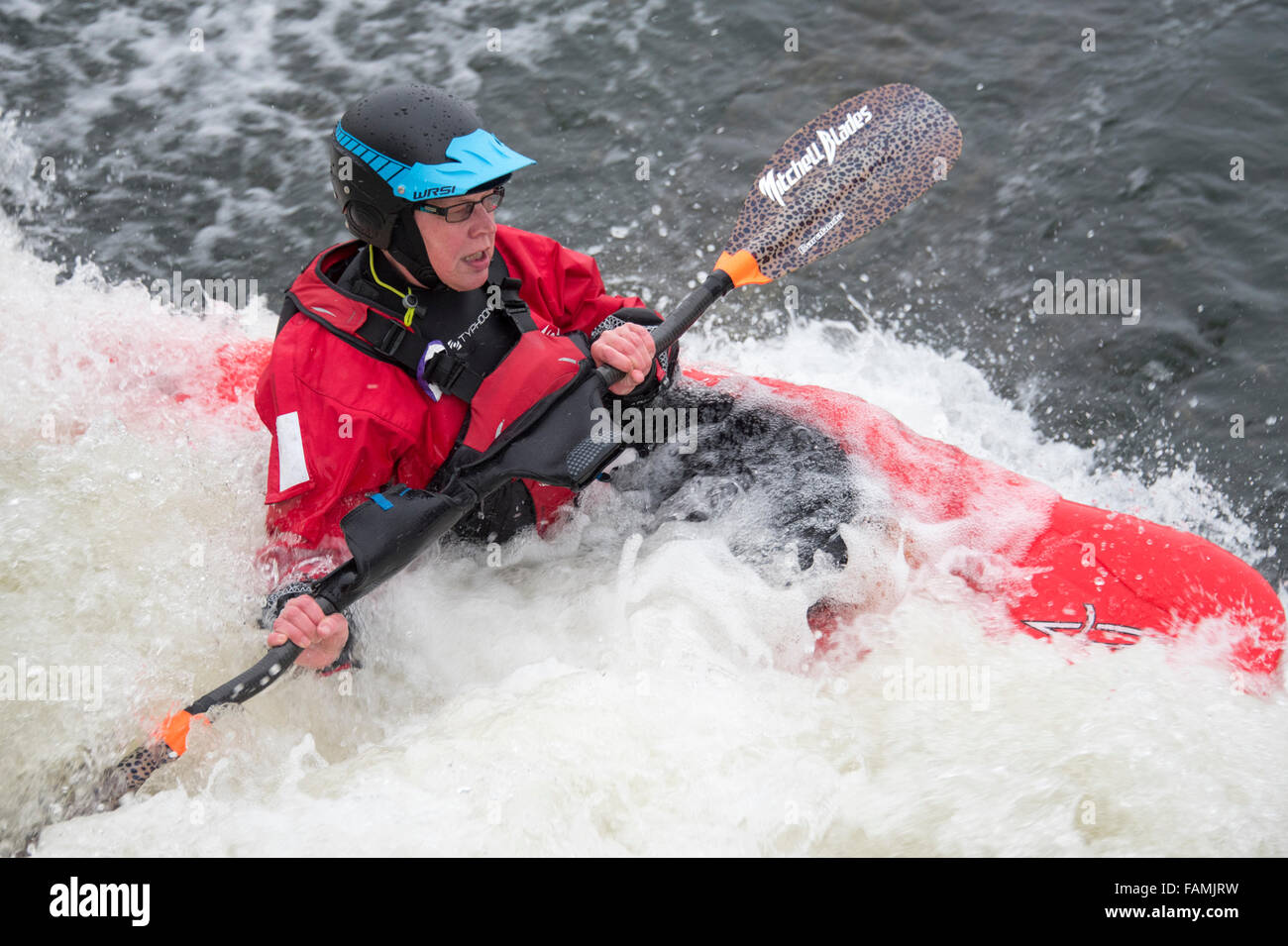 Woman kayaking in fast water Stock Photo - Alamy