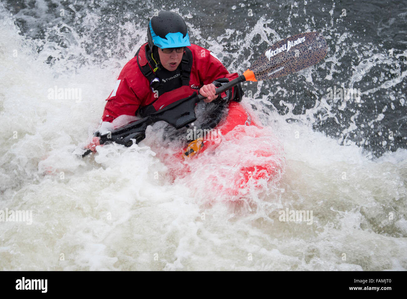 Woman kayaking in fast water Stock Photo - Alamy