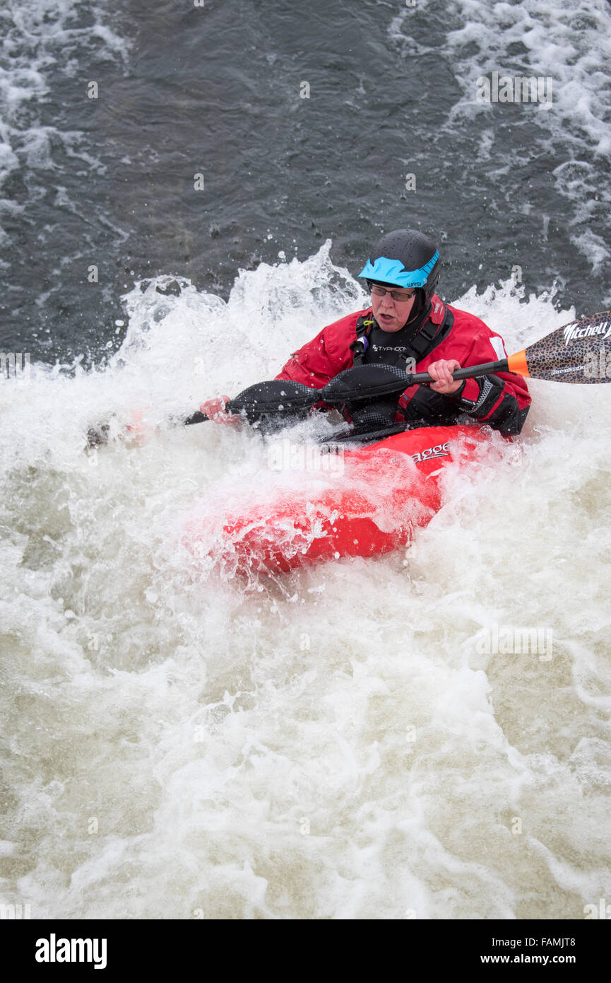 Woman kayaking in fast water Stock Photo - Alamy