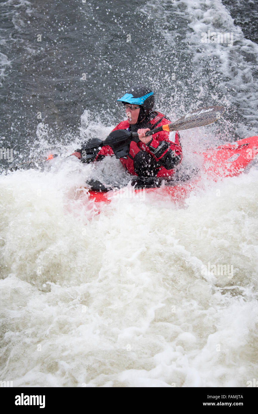 Woman kayaking in fast water Stock Photo - Alamy