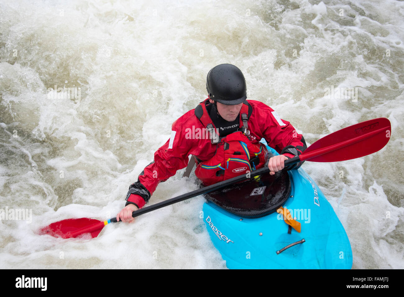 Man kayaking in fast water Stock Photo - Alamy