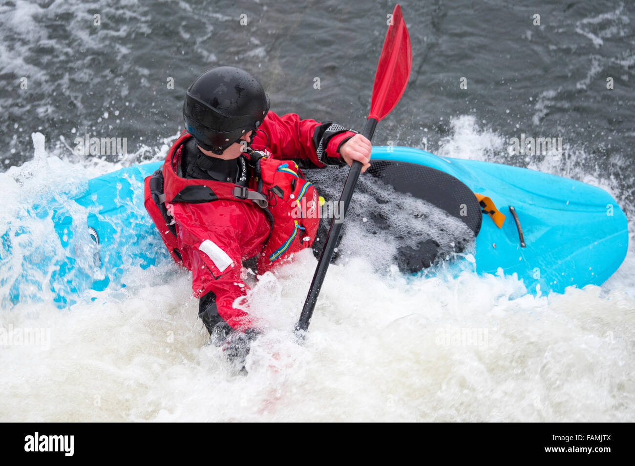 Man kayaking in fast water Stock Photo - Alamy