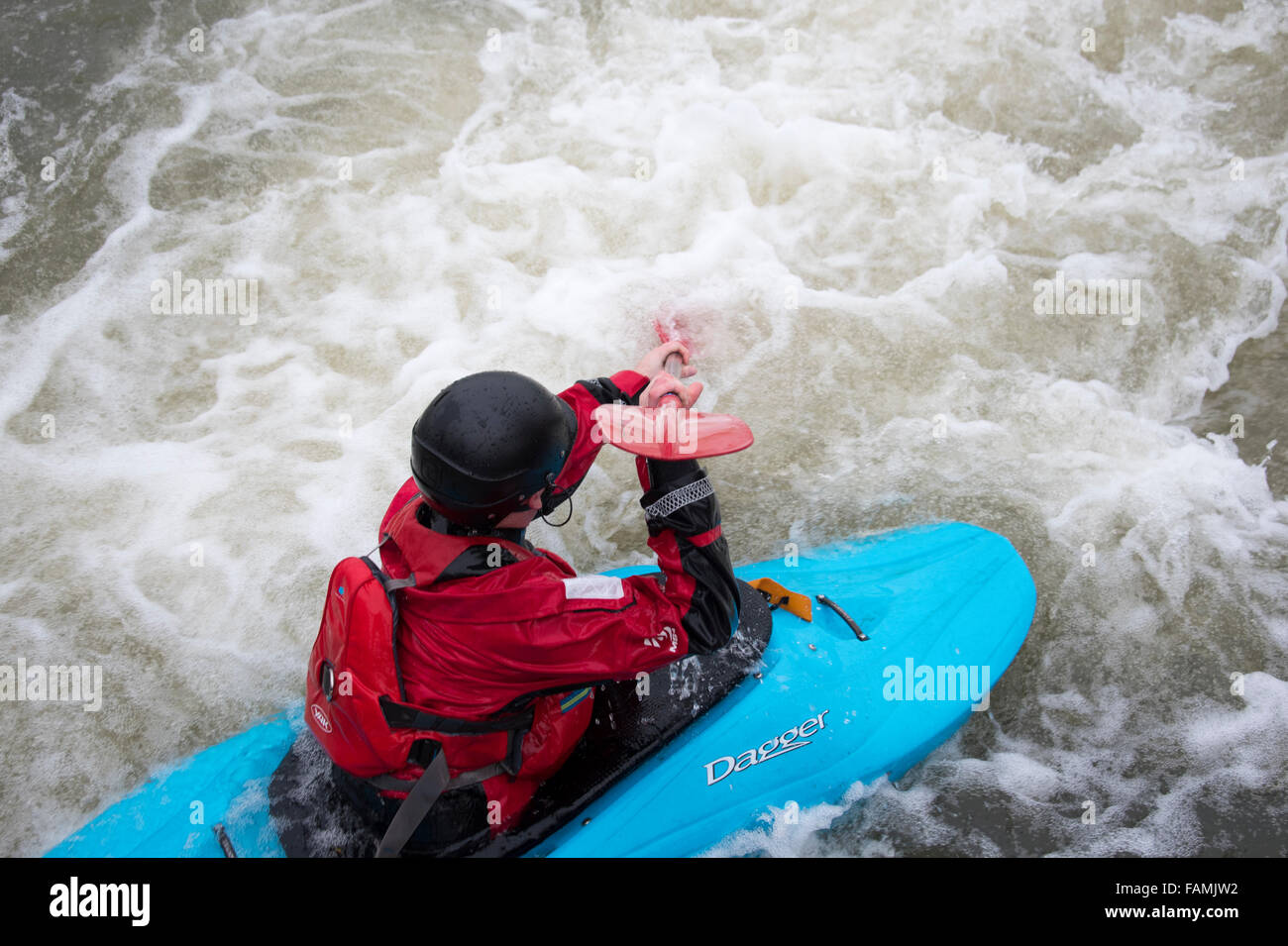 Woman kayaking in fast water Stock Photo - Alamy