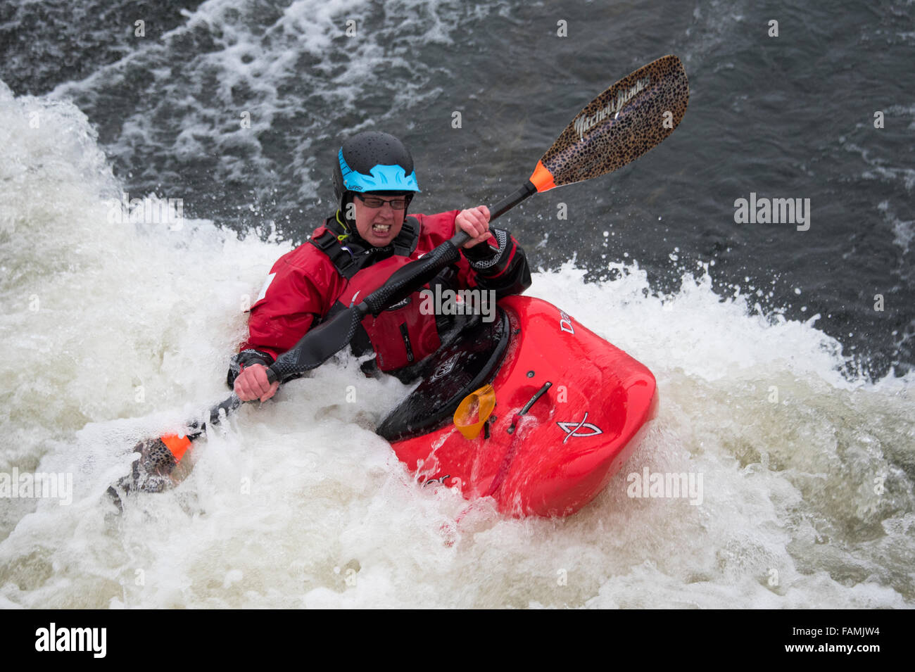 Woman kayaking in fast water Stock Photo - Alamy