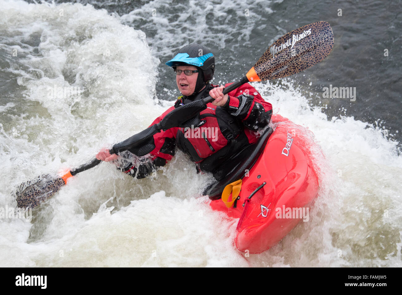 Woman kayaking in fast water Stock Photo - Alamy