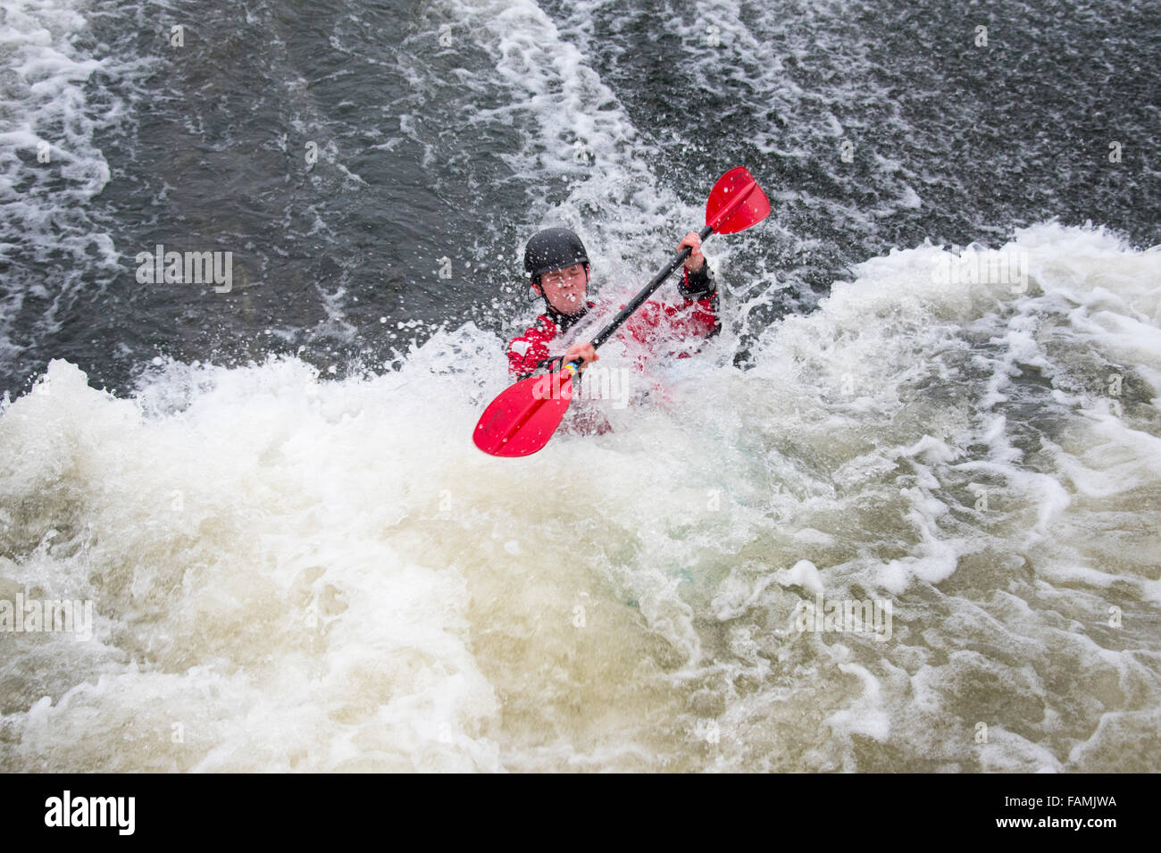 Man kayaking in fast water Stock Photo - Alamy