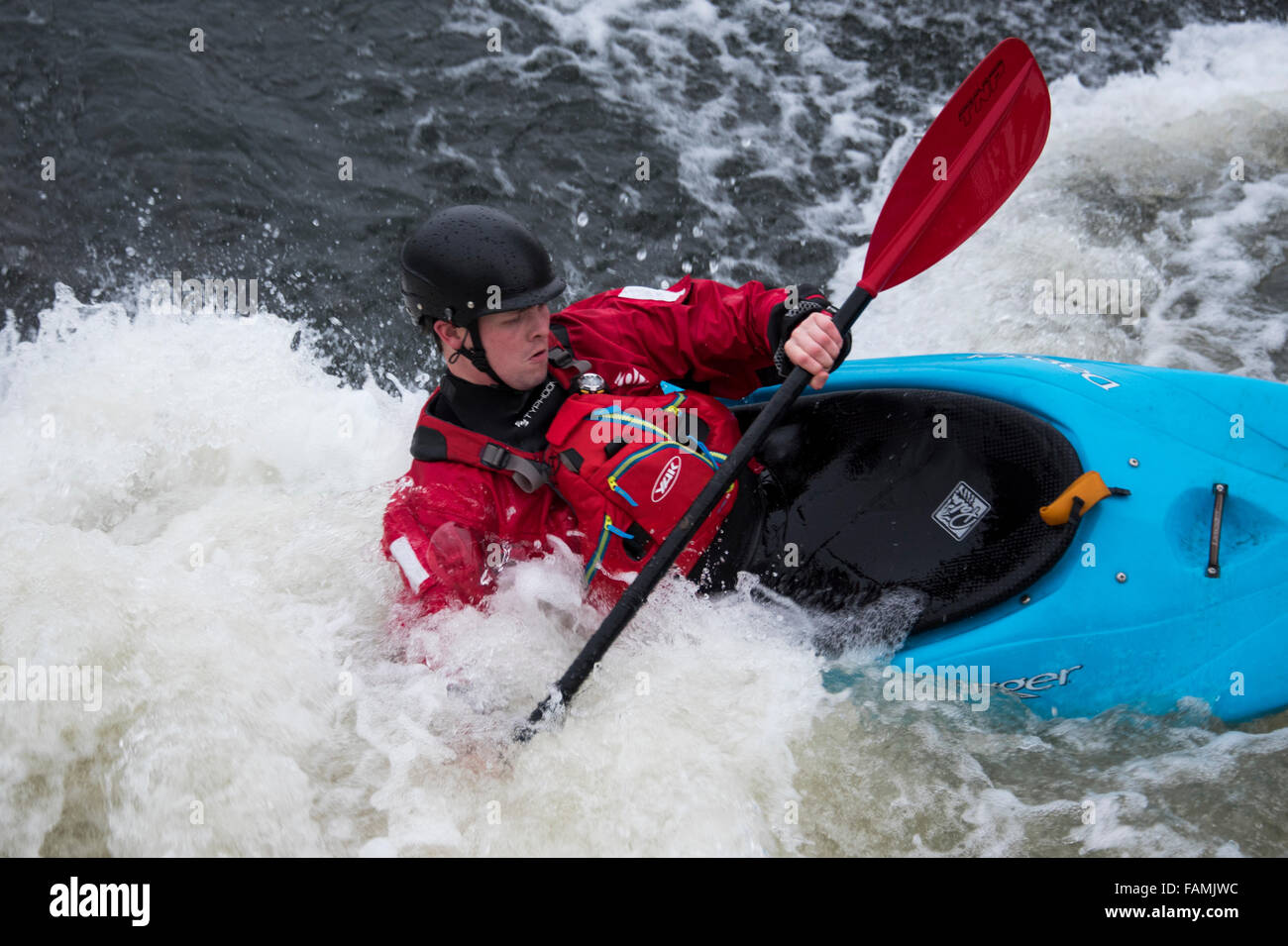 Man kayaking in fast water Stock Photo - Alamy