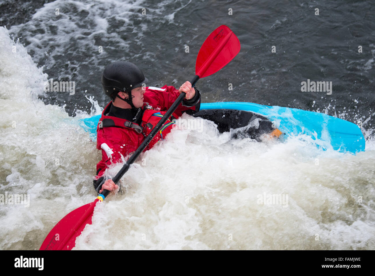 Man kayaking in fast water Stock Photo - Alamy