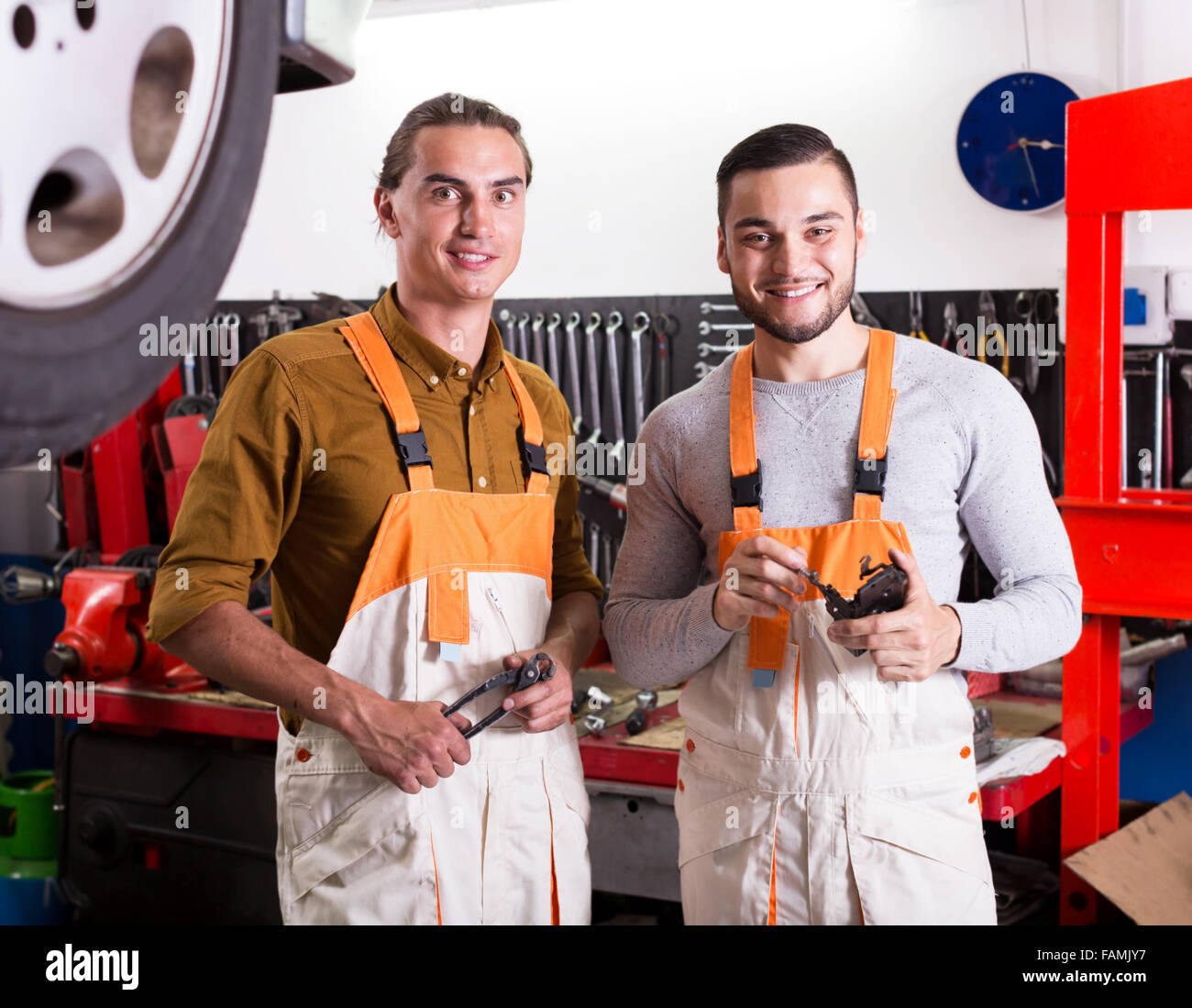 Portrait of two successful car mechanics at workshop Stock Photo - Alamy