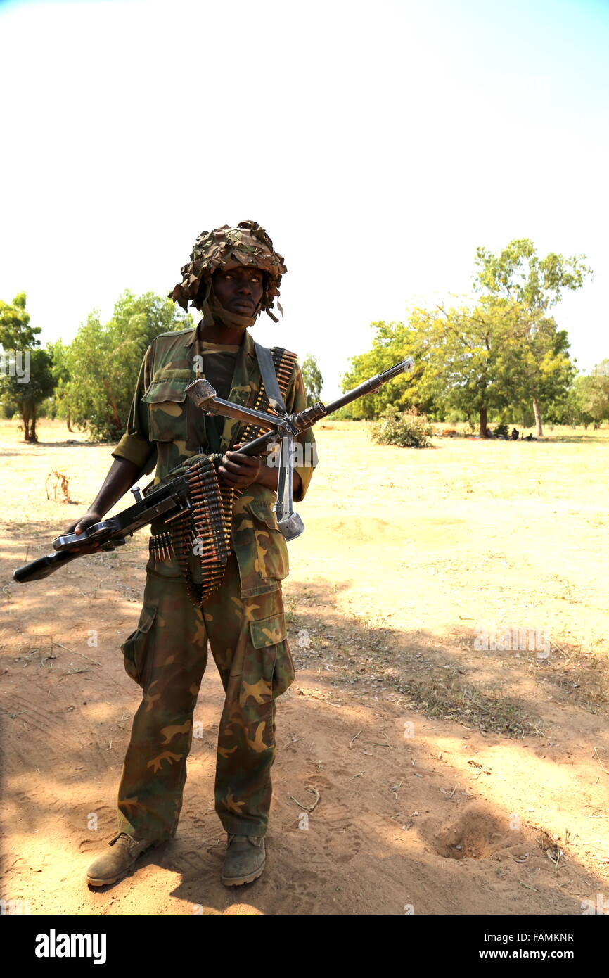 Nigerian soldier holding his heavy machine gun in Mubi State where arm ...