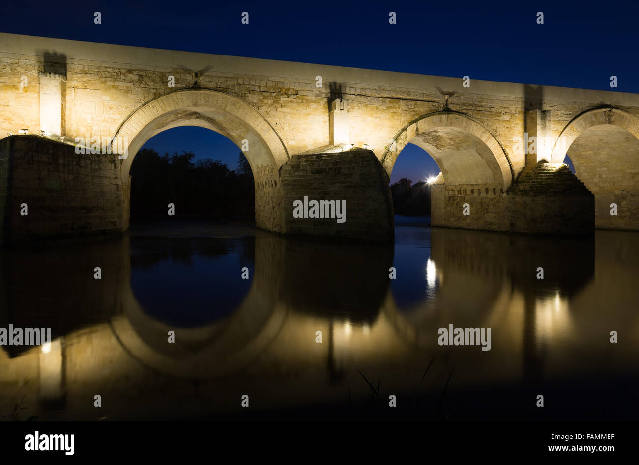 Ancient roman bridge over river in night Stock Photo - Alamy
