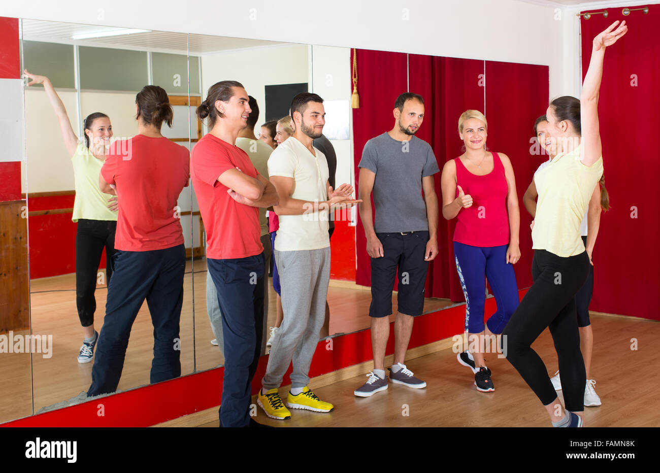 Dancing trainer showing group of people how to dance properly Stock ...