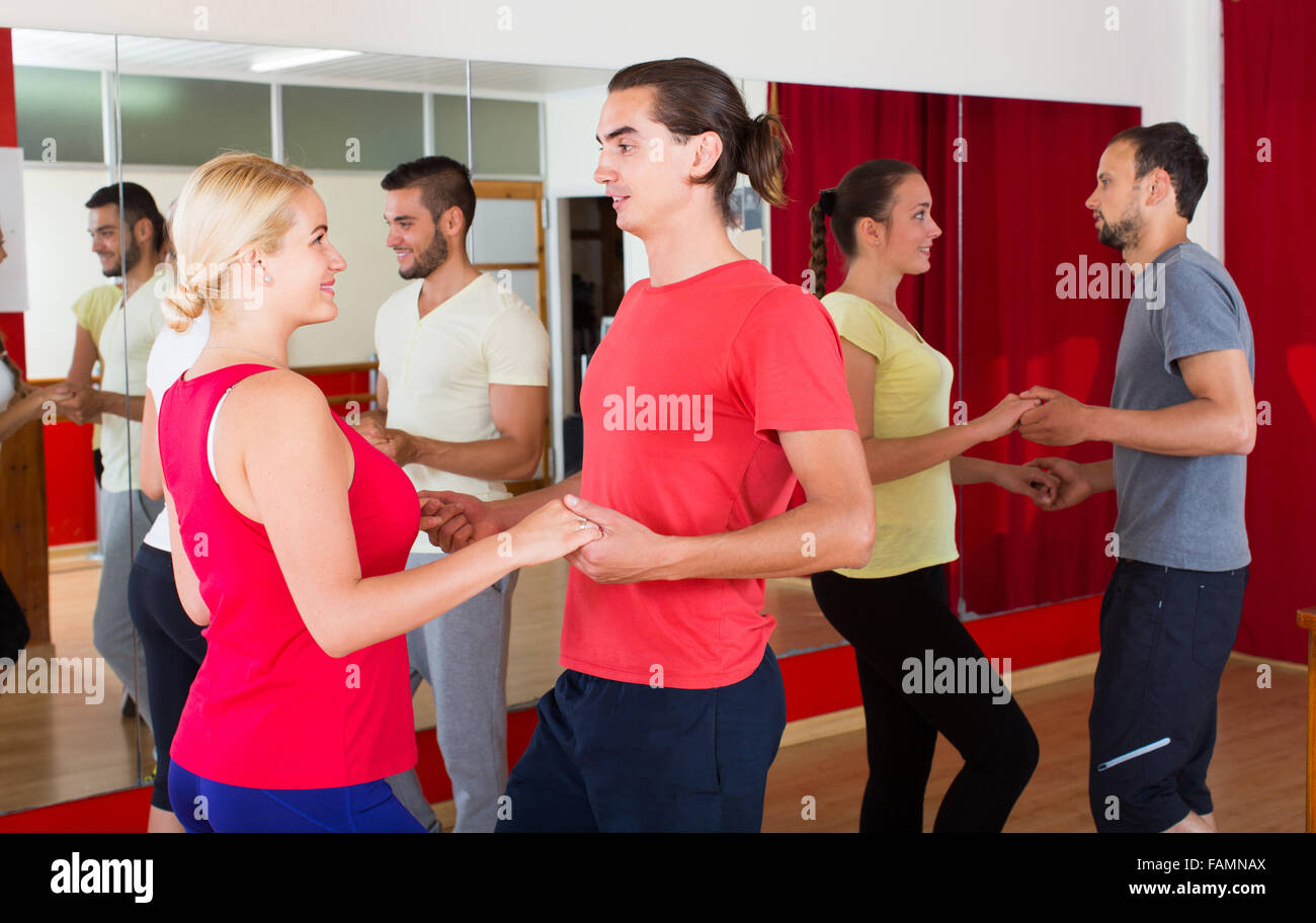 Group of american people dancing salsa in studio Stock Photo - Alamy