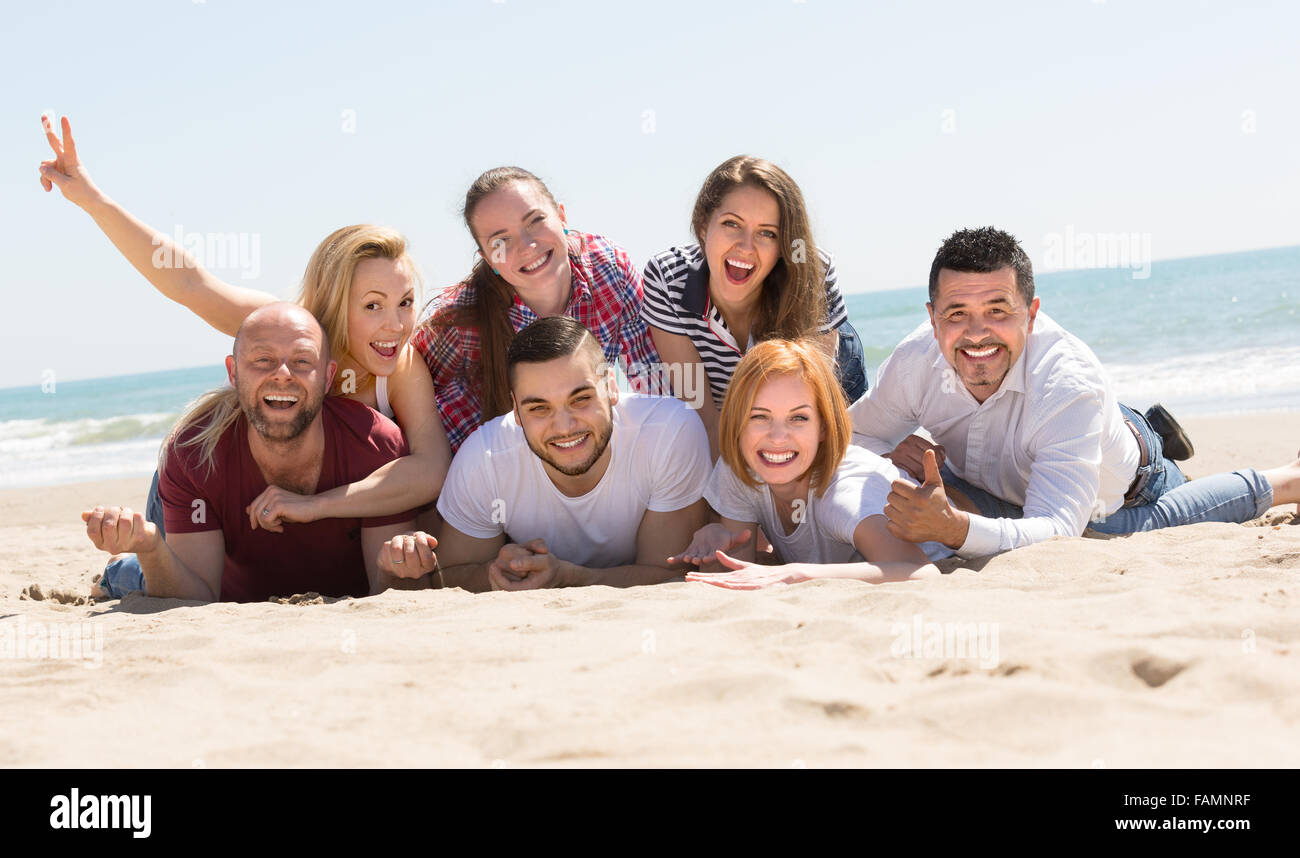 Happy smiling colleagues having summer corporate party at beach Stock ...
