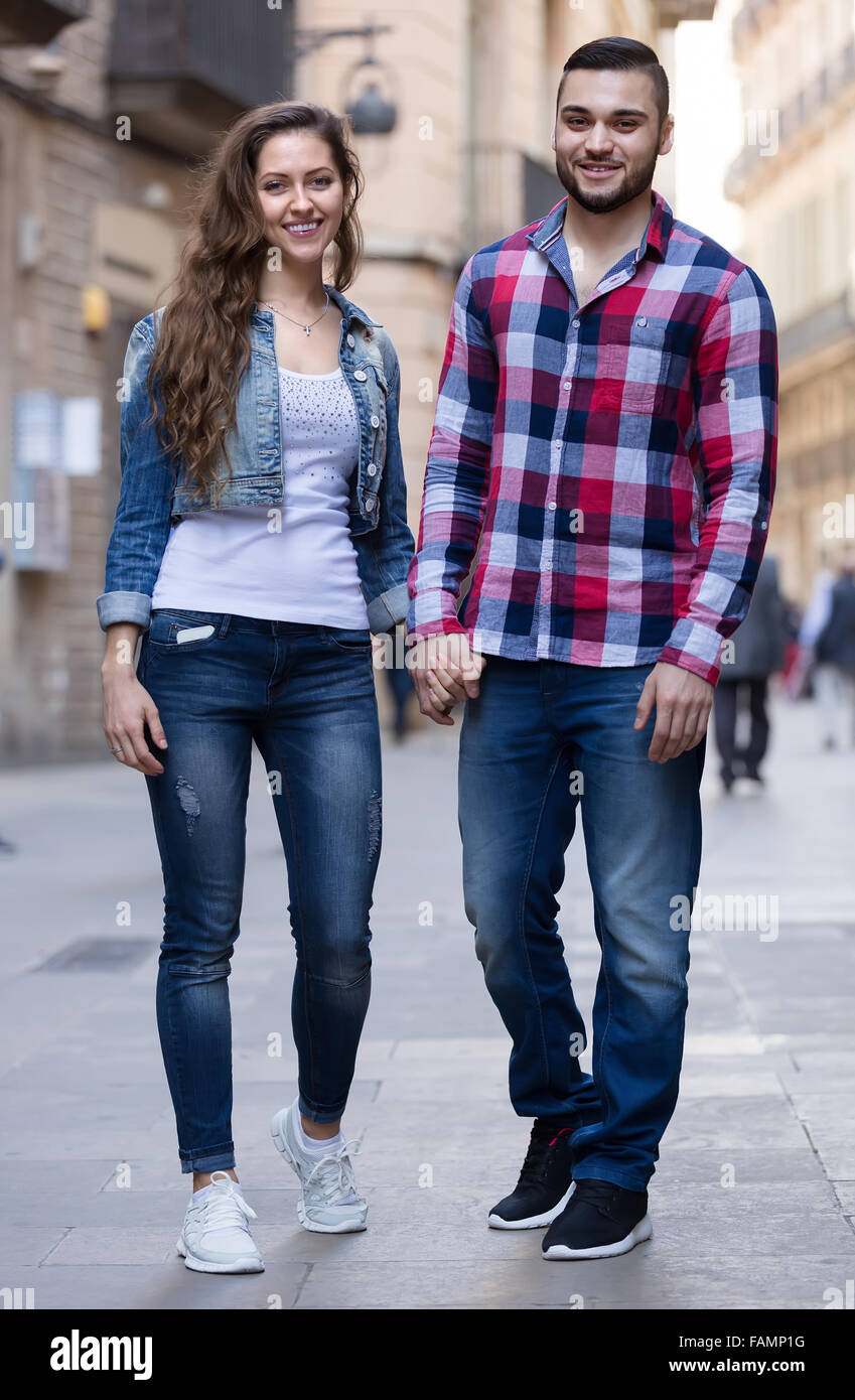 Happy people walking down the street together Stock Photo - Alamy