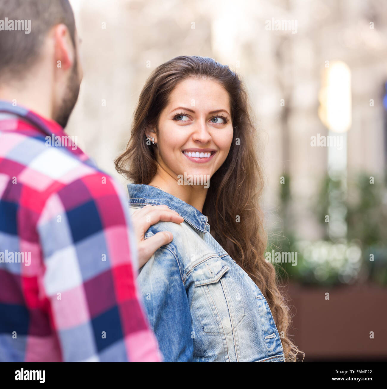 Handsome guy trying to get acquainted with pretty girl outdoors Stock ...
