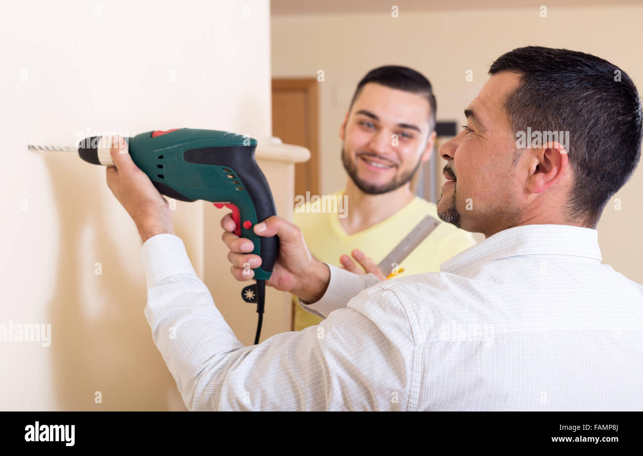 Two men doing maintenance hi-res stock photography and images - Alamy