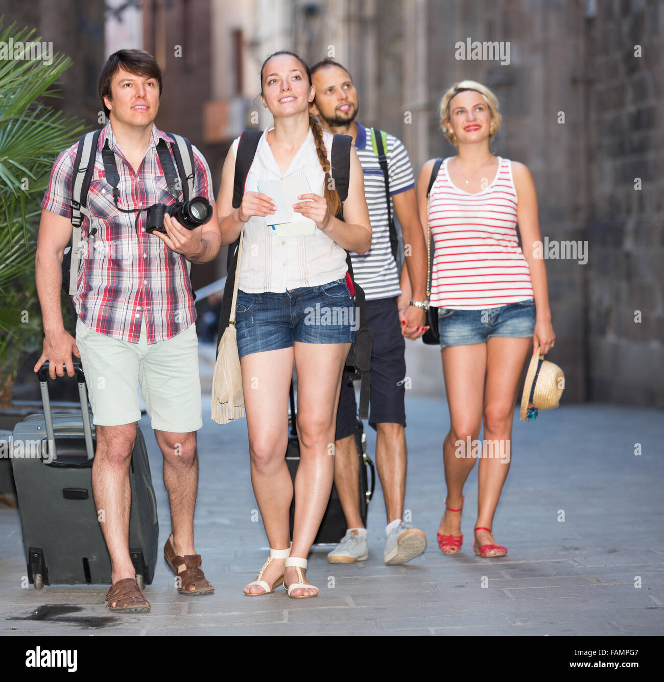 Happy tourists watching landmark at summer vacation Stock Photo - Alamy