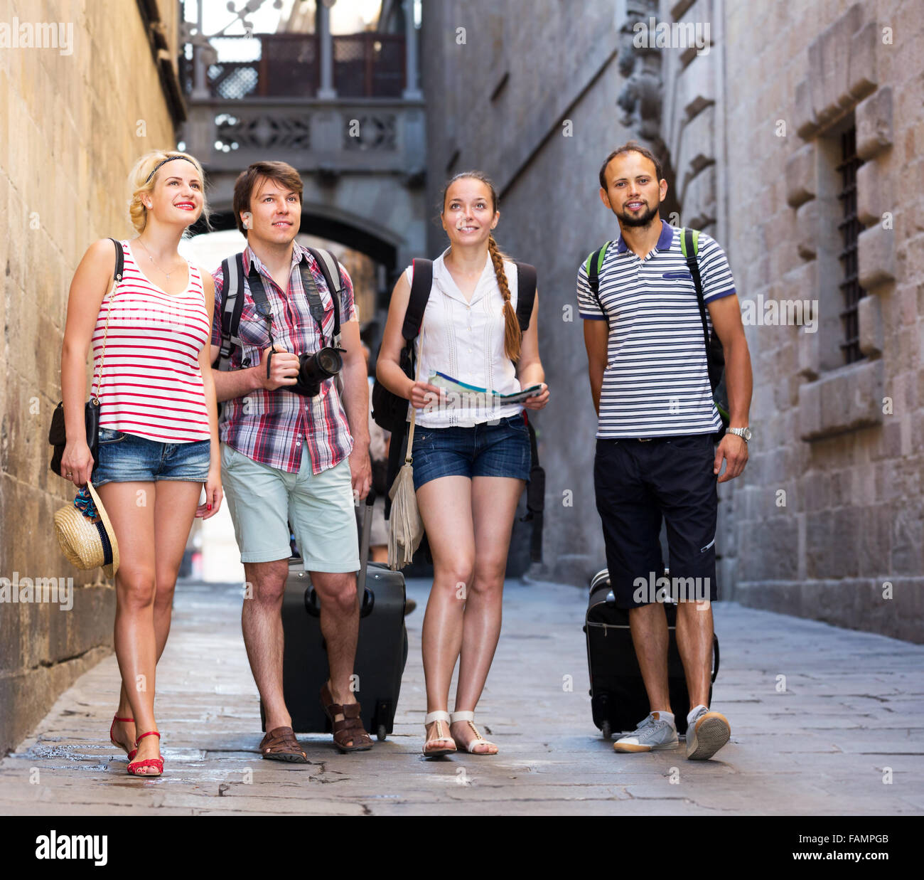Group of beautiful tourists with map and camera outdoors Stock Photo ...