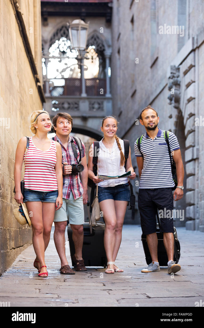 Group of cheerful tourists with map and camera outdoors Stock Photo - Alamy