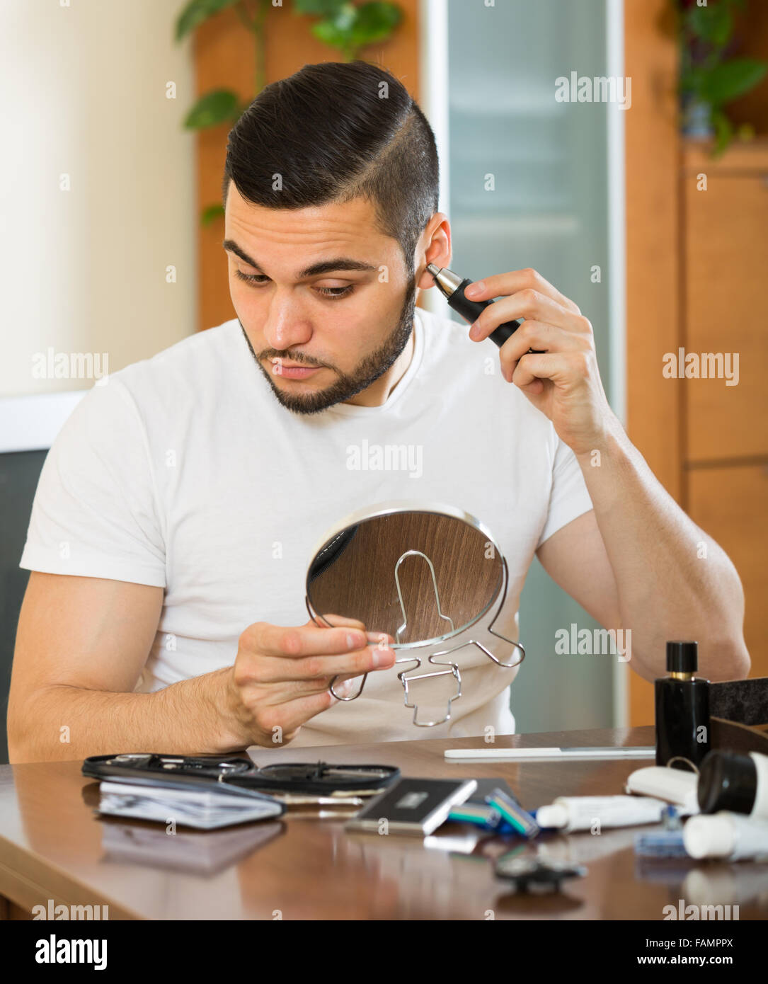 Guy 20 30 Years Old Remove Hair From His Nose And Ears With Trimmer