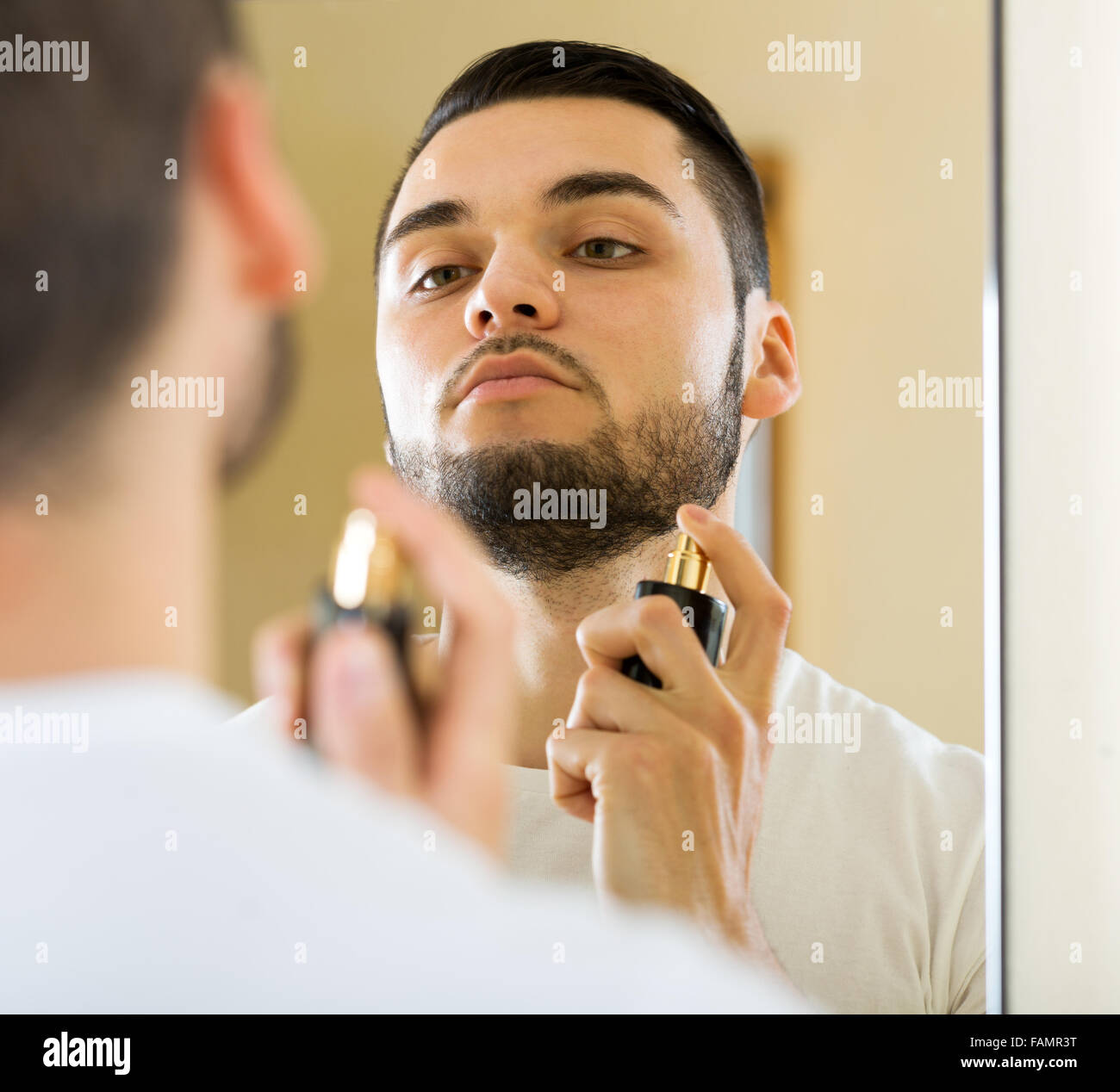 portrait handsome man applying perfume for keeping fresh Stock Photo ...
