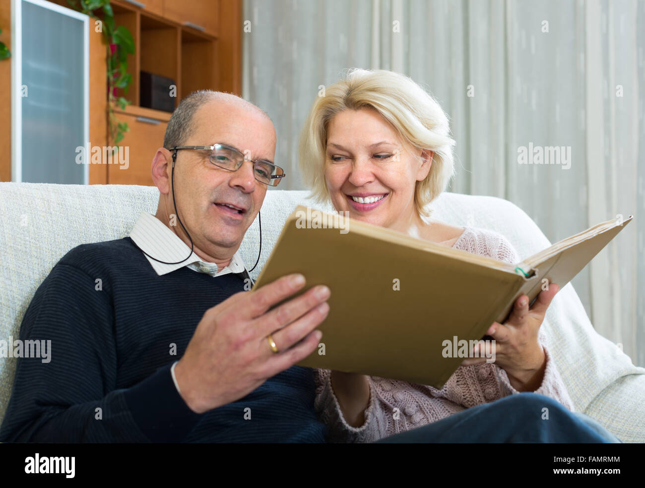 Happy senior spouses watching hi-res stock photography and images - Alamy