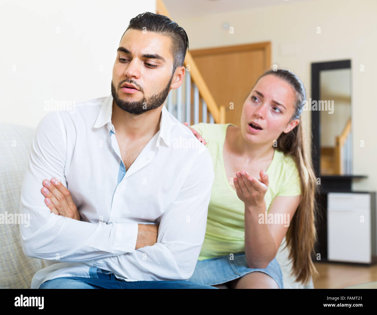 Worried american man and woman talking stressfully Stock Photo - Alamy