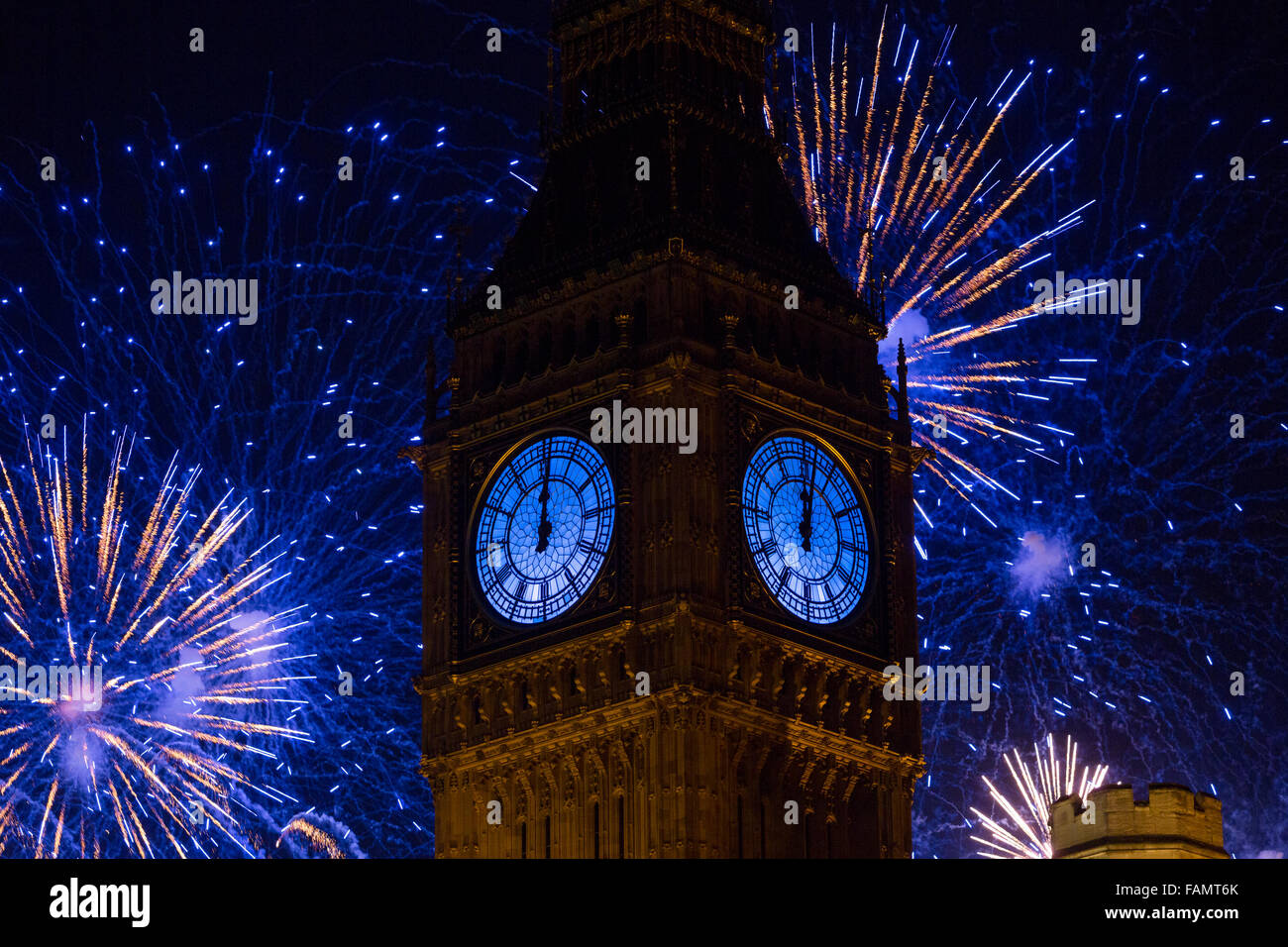 London, UK. 1st January 2016. Fireworks explode and light up Big Ben in ...