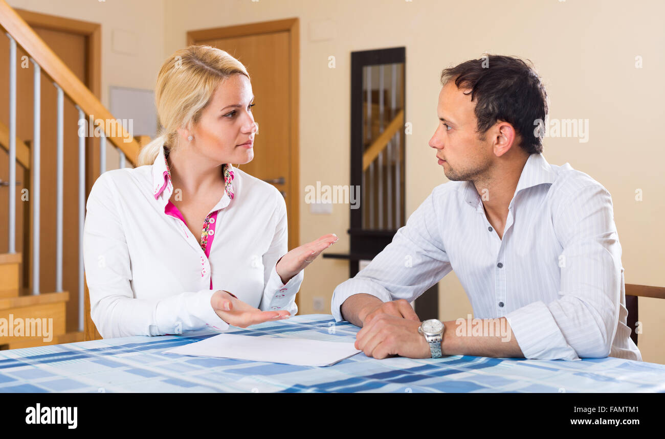 Ordinary married couple having serious talking in home interior Stock ...