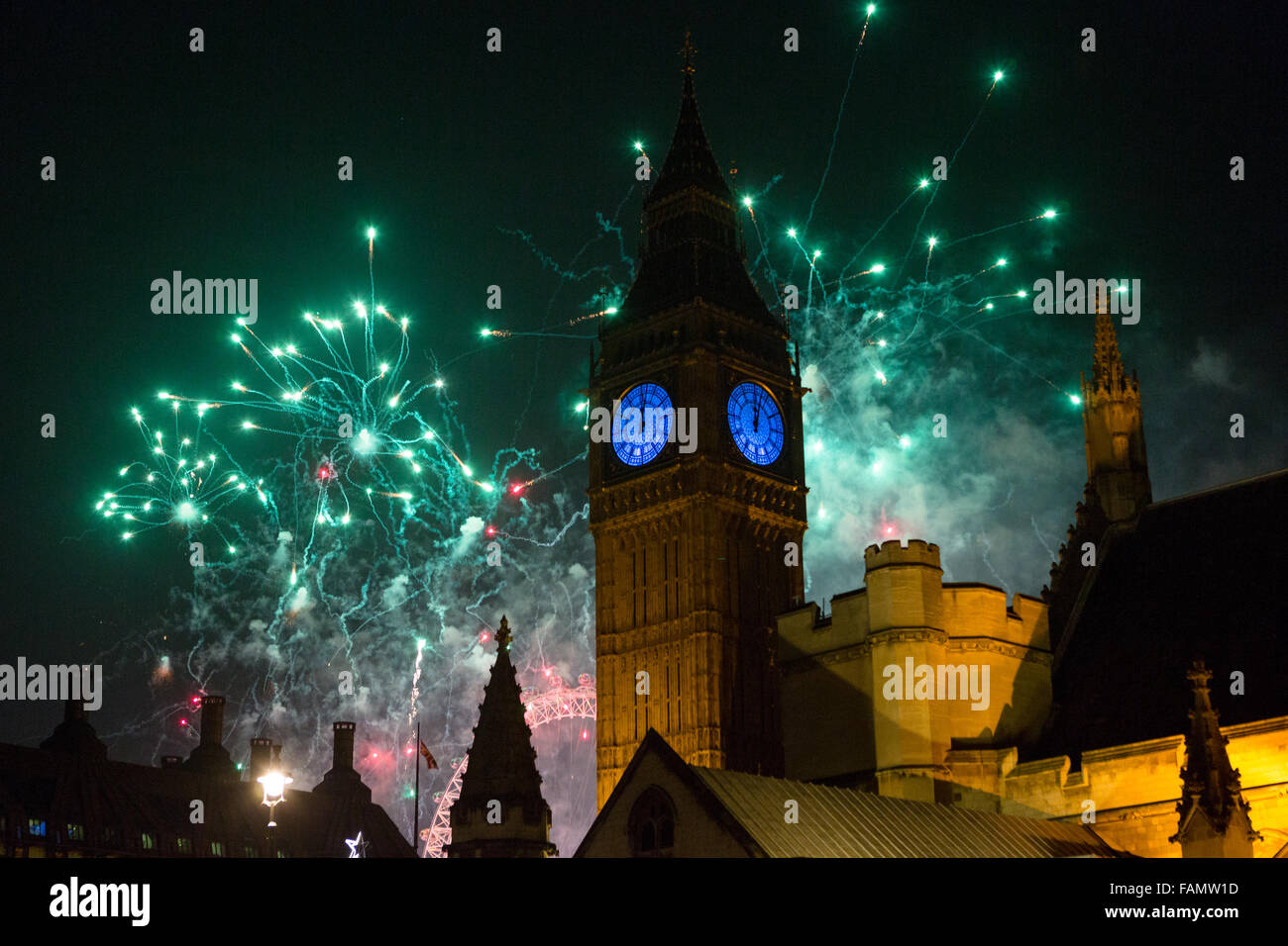 London, UK. 1st January 2016. Fireworks explode and light up Big Ben in ...