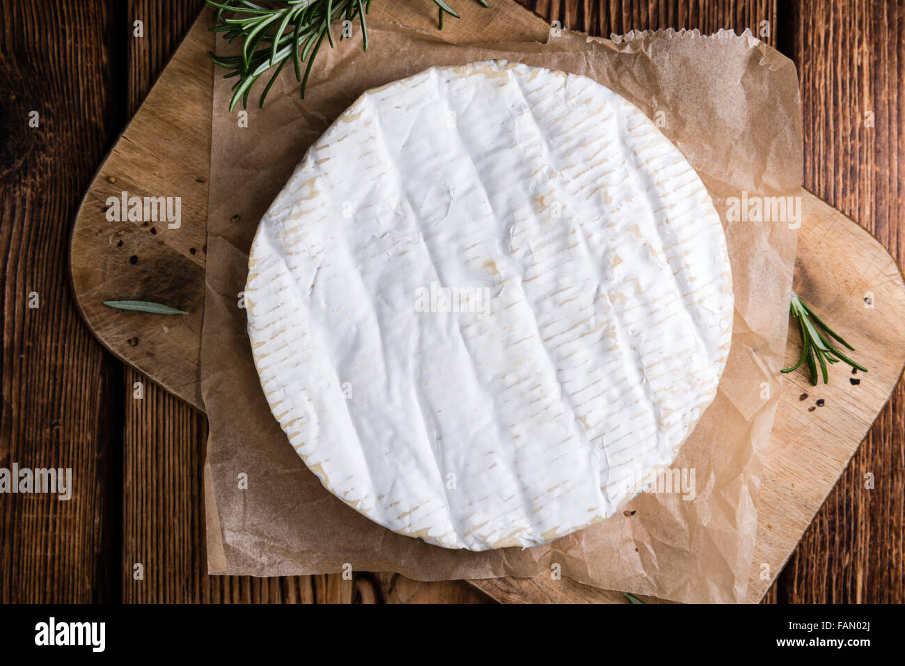 Camembert (close-up shot) on an old rustic wooden table Stock Photo - Alamy