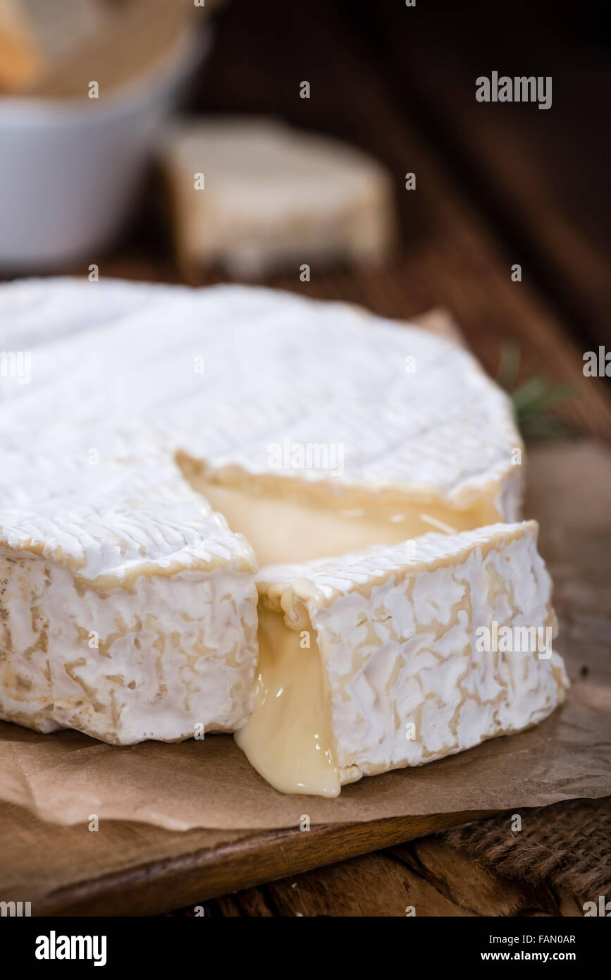 Camembert (close-up shot) on an old rustic wooden table Stock Photo - Alamy
