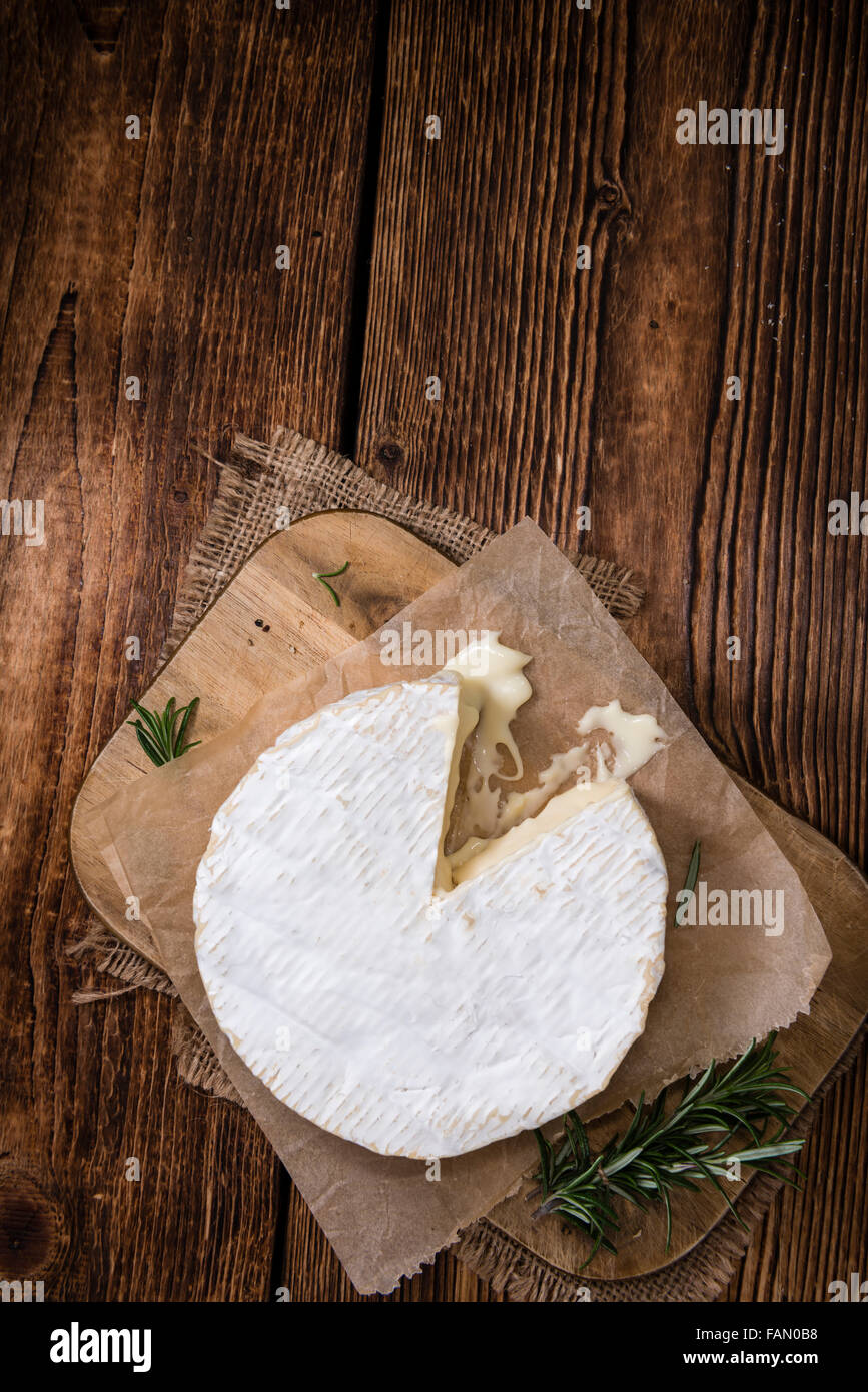 Camembert (close-up shot) on an old rustic wooden table Stock Photo - Alamy
