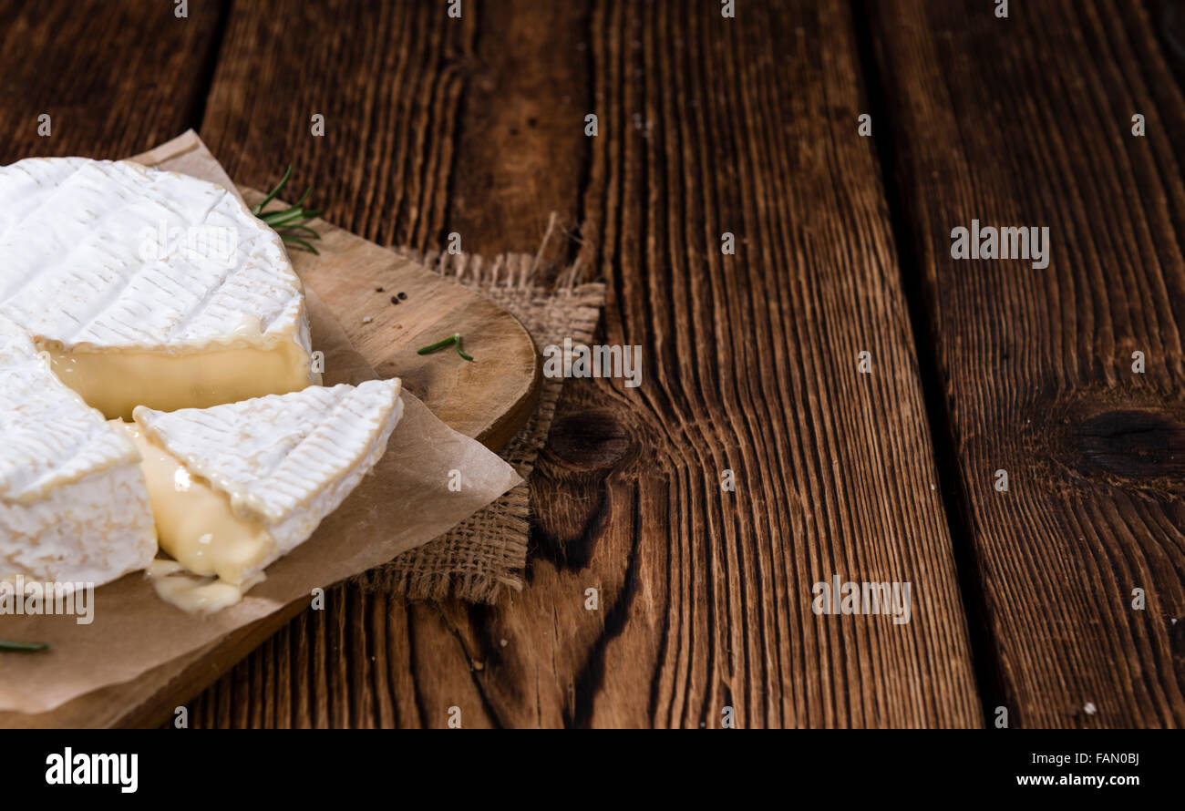 Camembert (close-up shot) on an old rustic wooden table Stock Photo - Alamy