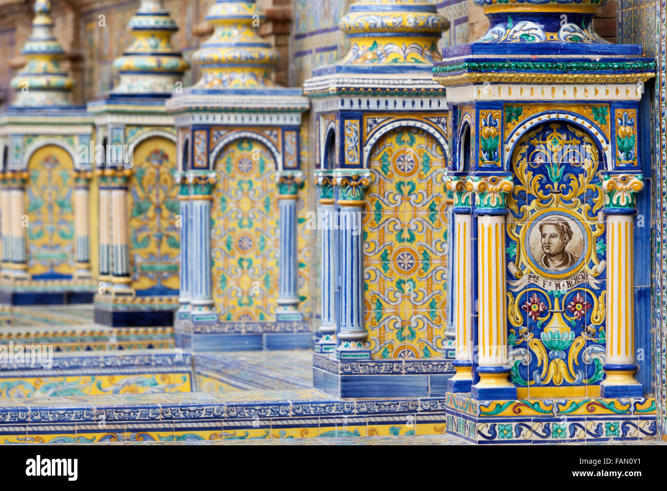 Azulejos, painted ceramic tiles in alcoves in Plaza de España, Seville ...
