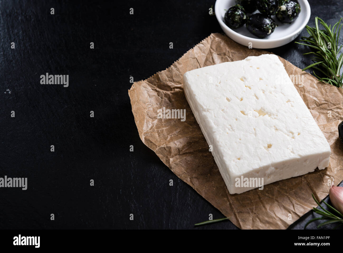 Fresh Feta Cheese (detailed close-up shot) on vintage background Stock ...