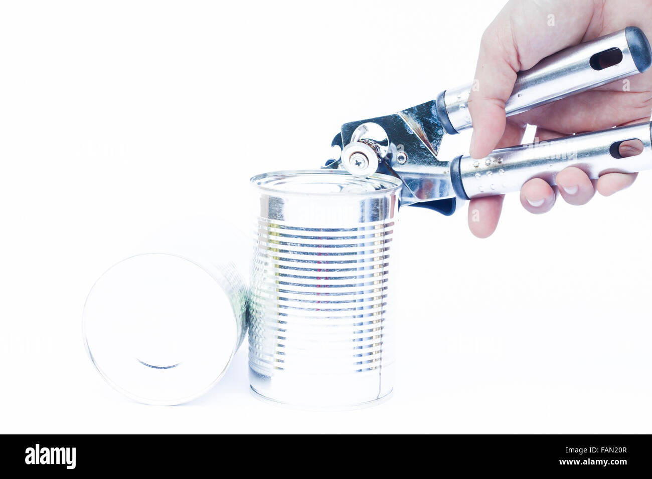 Close-up tin can with hand isolated on white background, stock photo ...