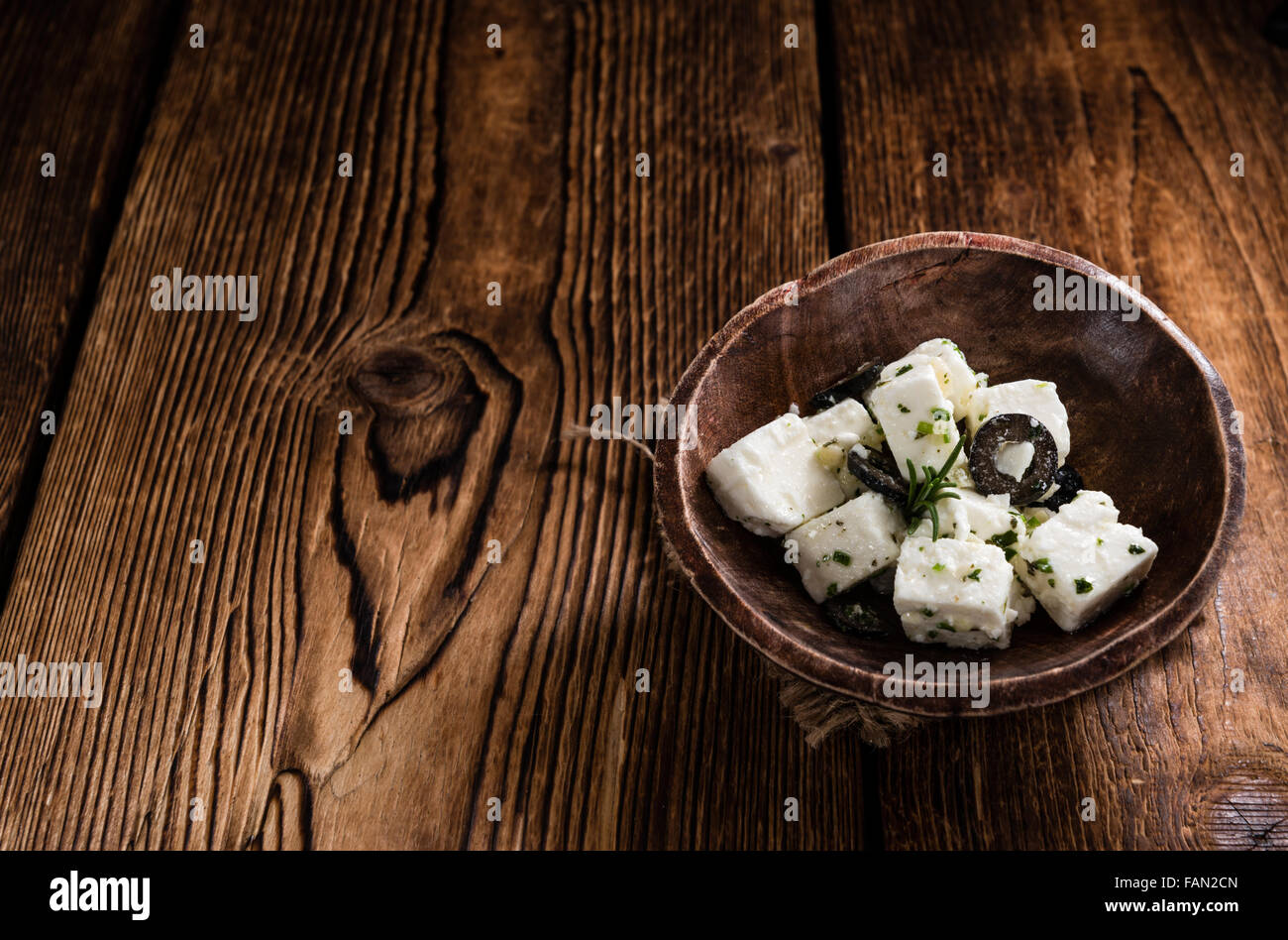 Marinated Feta Cheese (close-up shot on wooden background Stock Photo ...