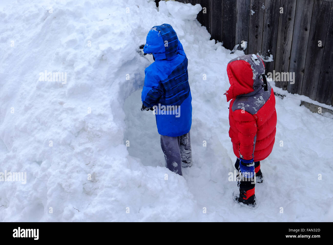 Boys Building Igloo Stock Photo - Alamy