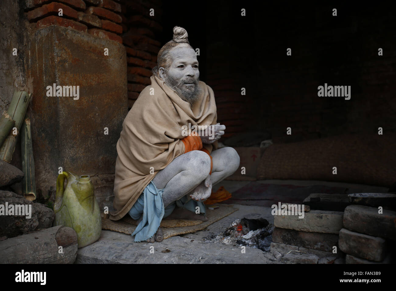 Kathmandu, Nepal. 2nd Jan, 2016. A Sadhu baba (Holy man) keeps himself ...