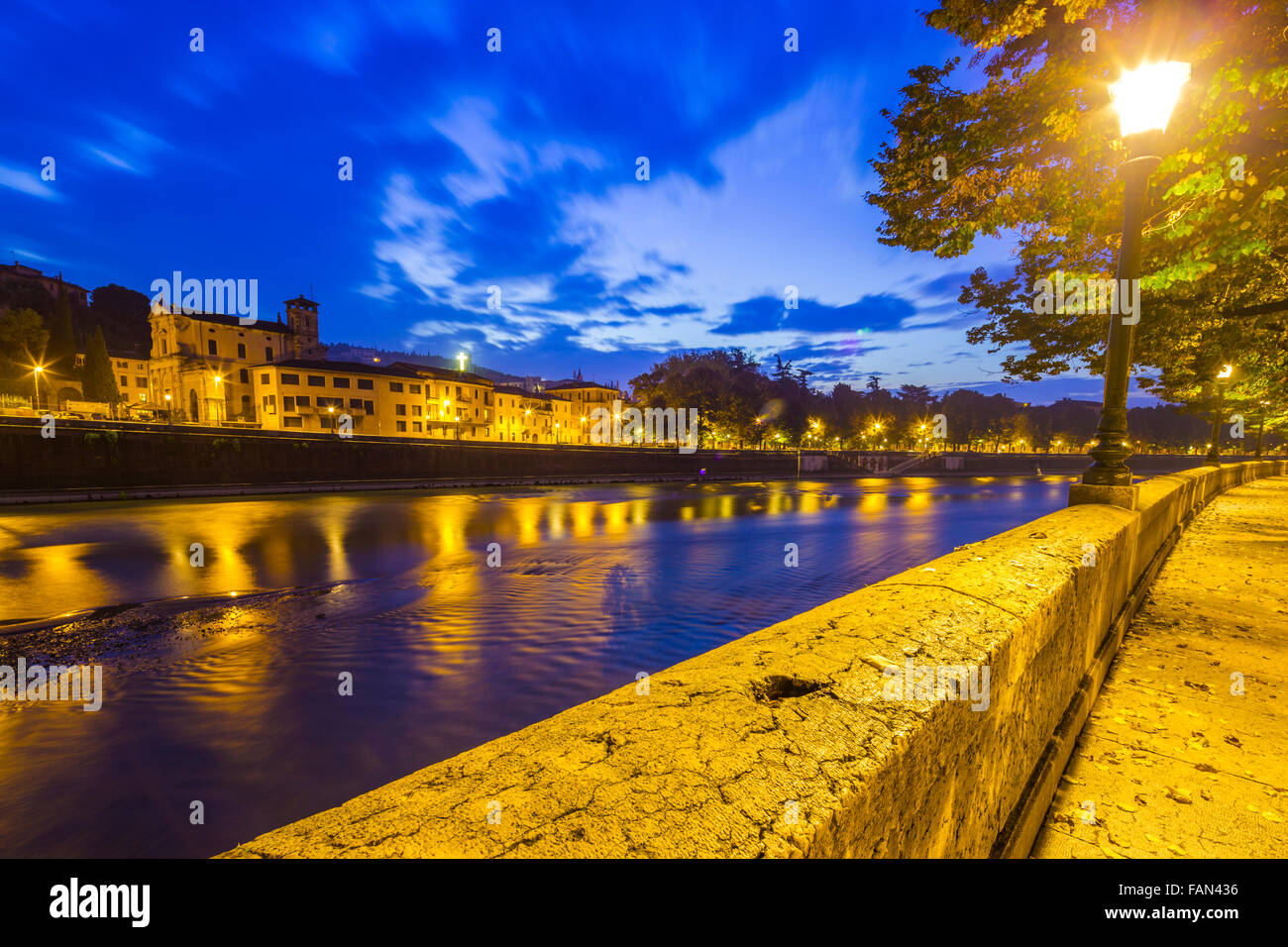 Fiume Adige River flowing by appartments at dawn; Verona Stock Photo ...