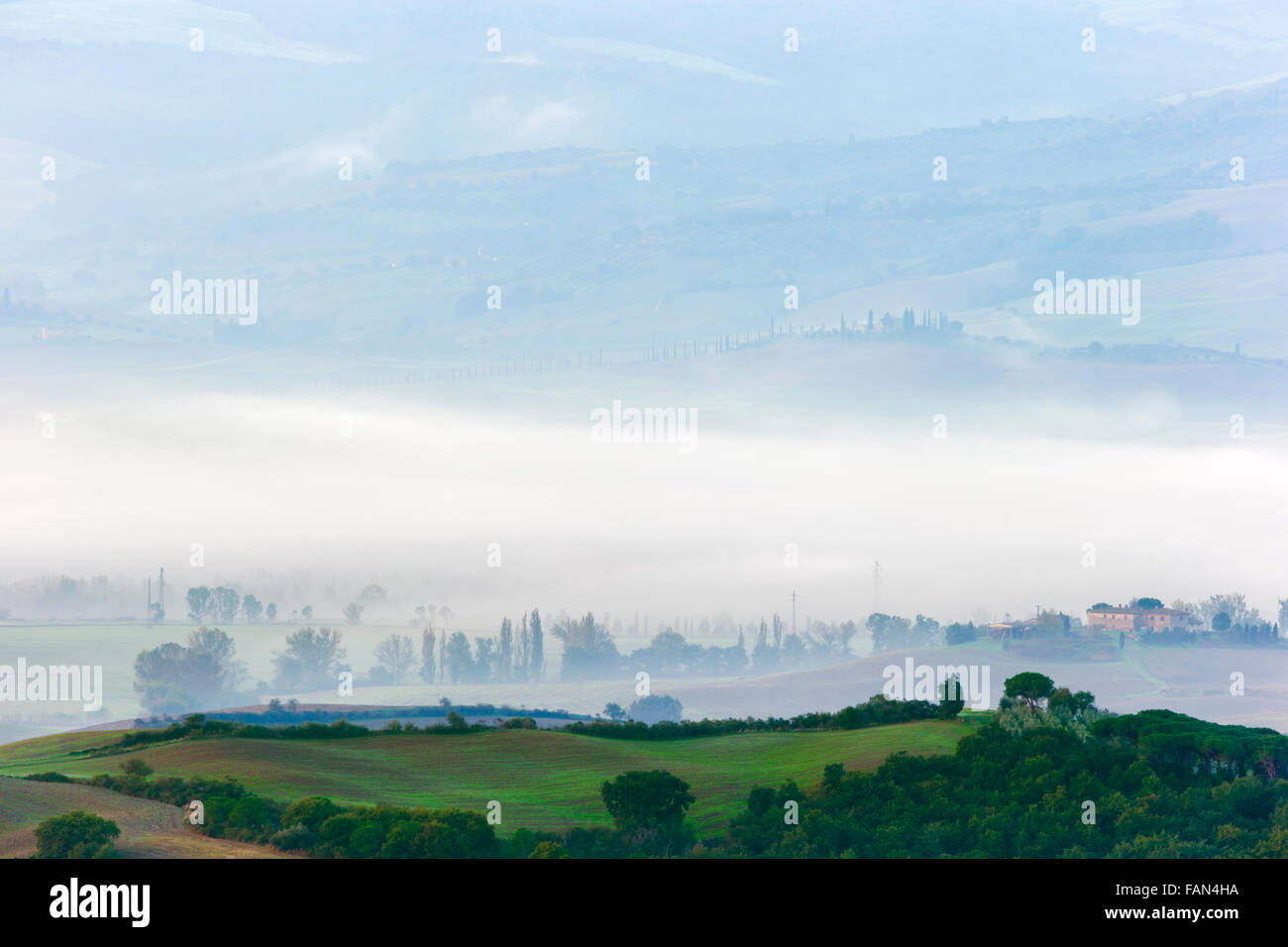 rolling hills and agricultural land near town of Monticchiello at dawn ...
