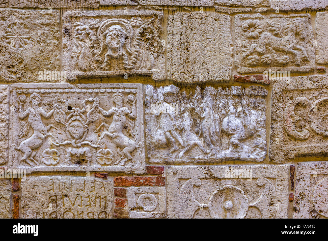 aged artifacts in wall, Tuscany Stock Photo - Alamy