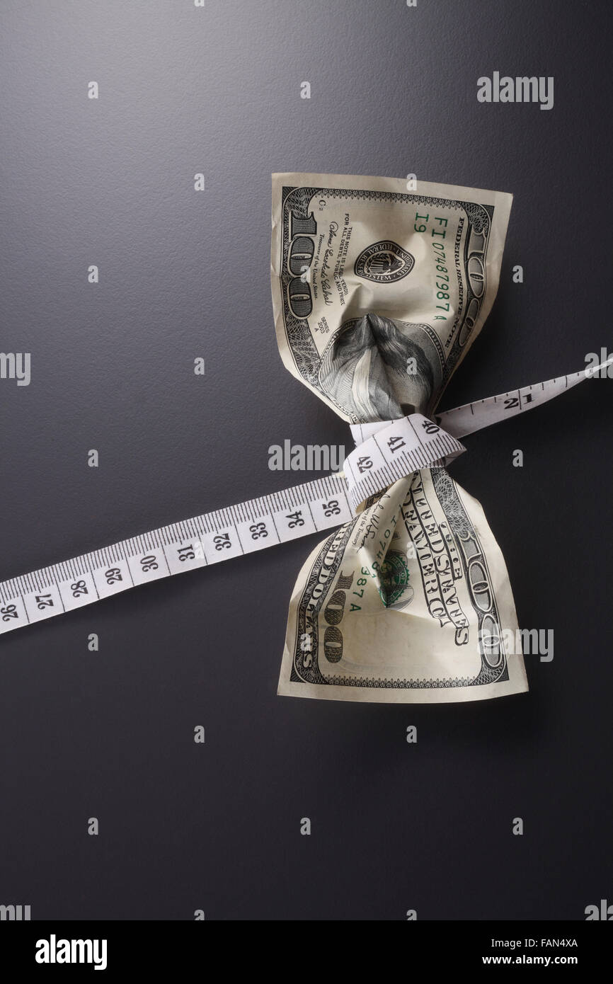 close up of the us currency and tape measure Stock Photo - Alamy