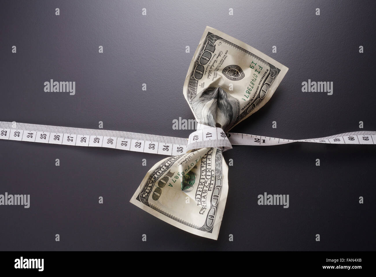 close up of the us currency and tape measure Stock Photo - Alamy