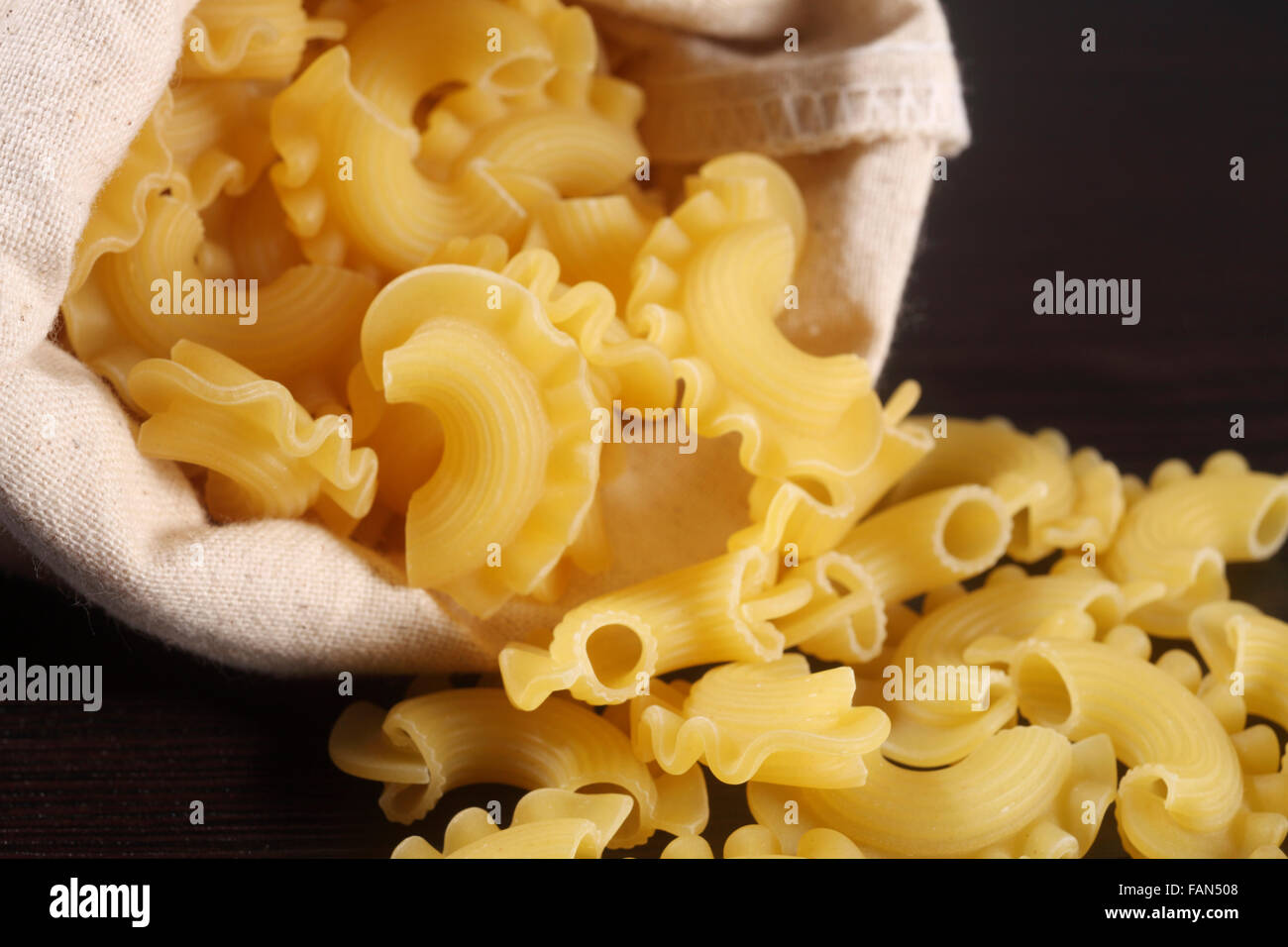 pasta pouring from the sack Stock Photo - Alamy