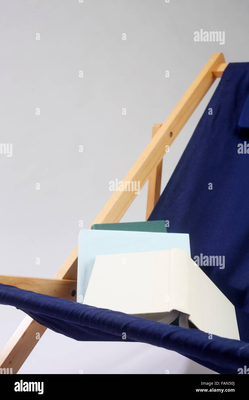 Deck chair made of wooden frame and sky blue canvas Stock Photo - Alamy